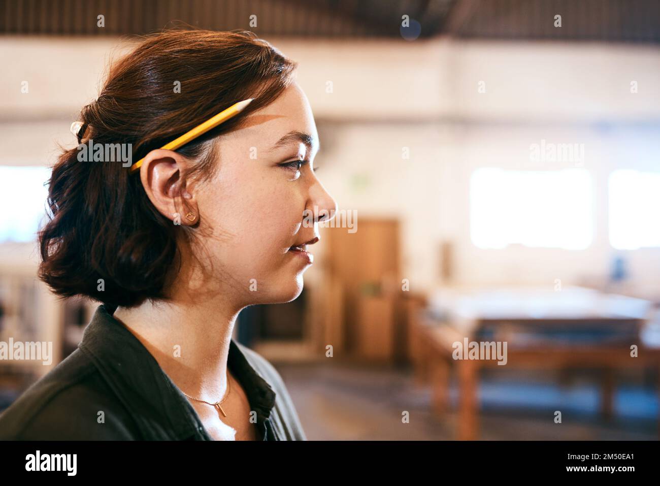 I design and build everything myself. Cropped of a female carpenter ...