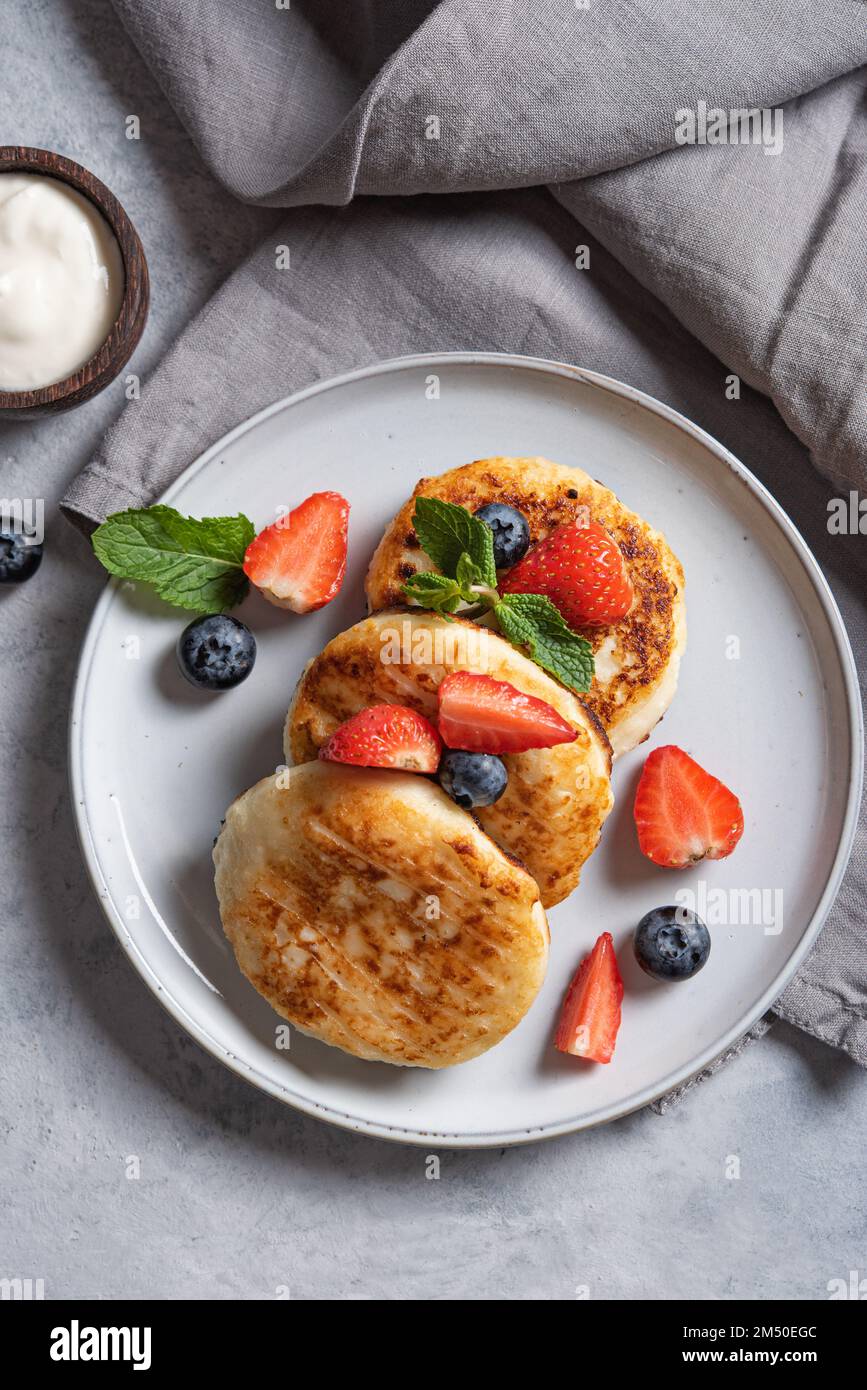 Traditional Russian dish for breakfast syrniki. Cottage cheese pancakes ...