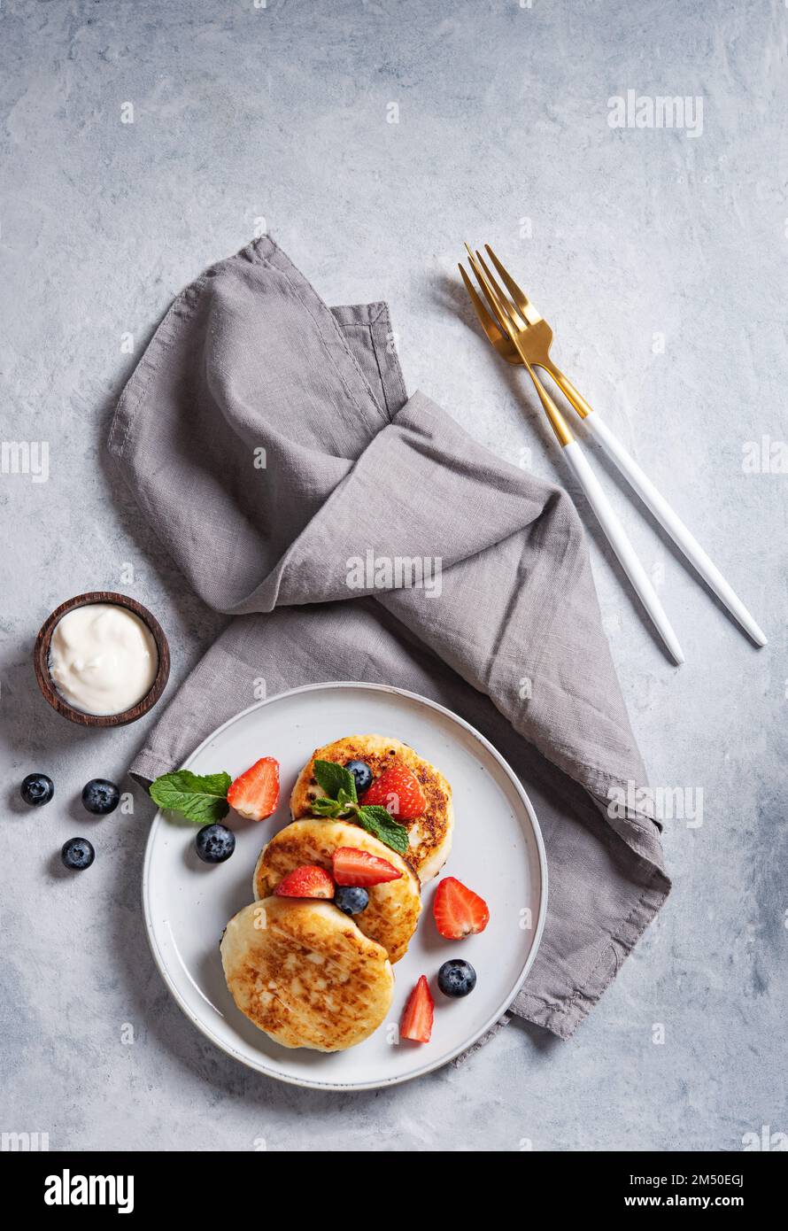 Traditional Russian dish for breakfast syrniki. Cottage cheese pancakes ...