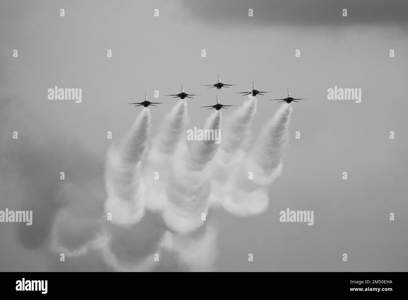 A grayscale of aircrafts on the sky during air show Stock Photo - Alamy