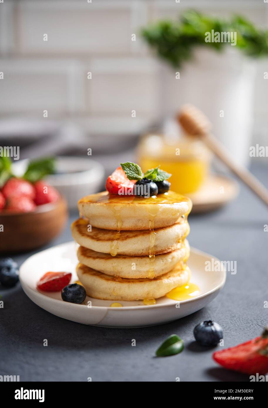 Homemade classic American pancakes in a stack with fresh berries and ...