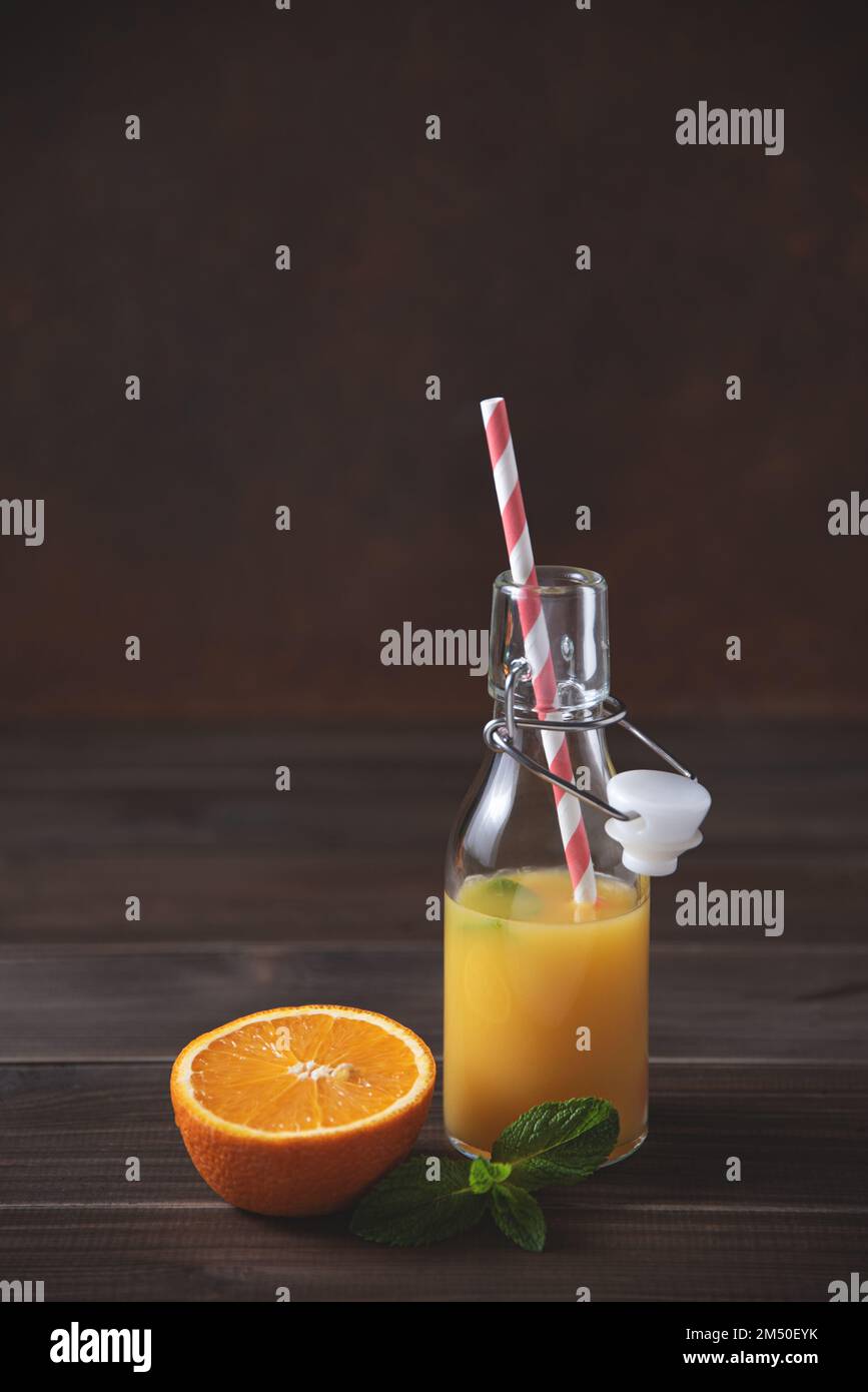 Minimalism tinting concept. Freshly squeezed orange juice in bottle ...