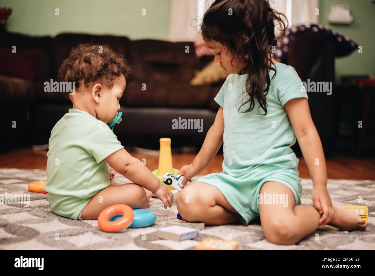 Brother and sister playing toys hi-res stock photography and images - Alamy