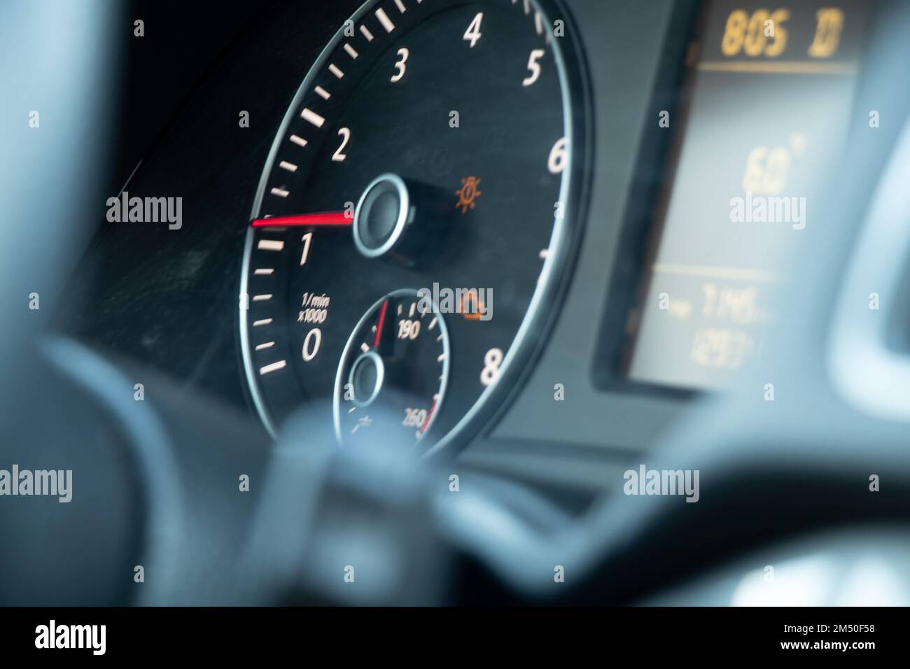 speedometer and steering wheel in auto close-up Stock Photo - Alamy