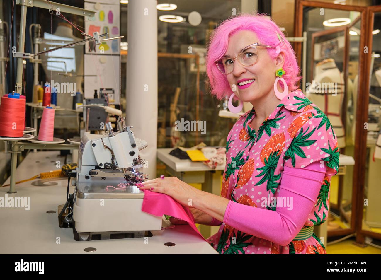 Tailor pink hair smiling hi-res stock photography and images - Alamy