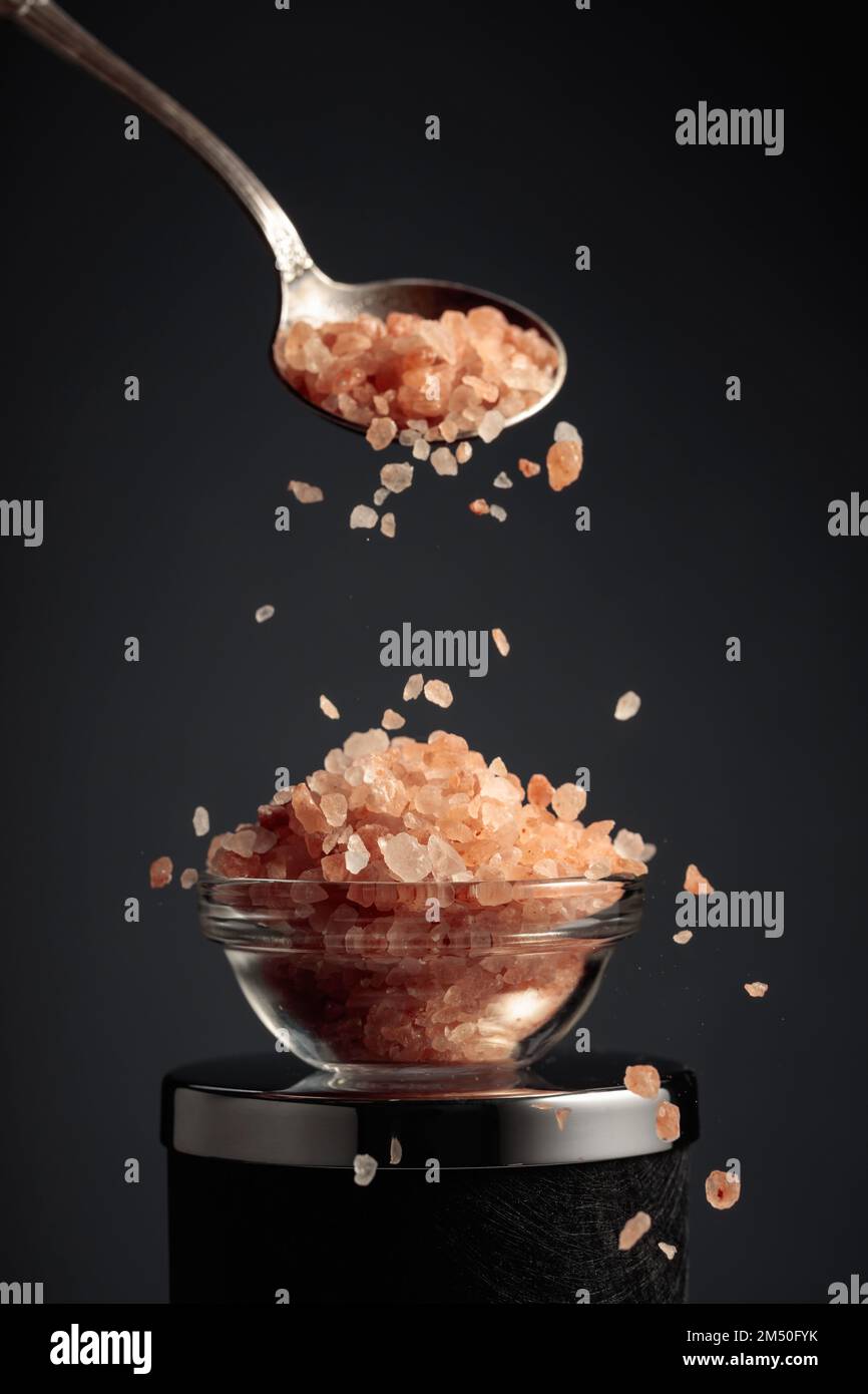 Pink salt is poured into a small glass bowl Stock Photo - Alamy