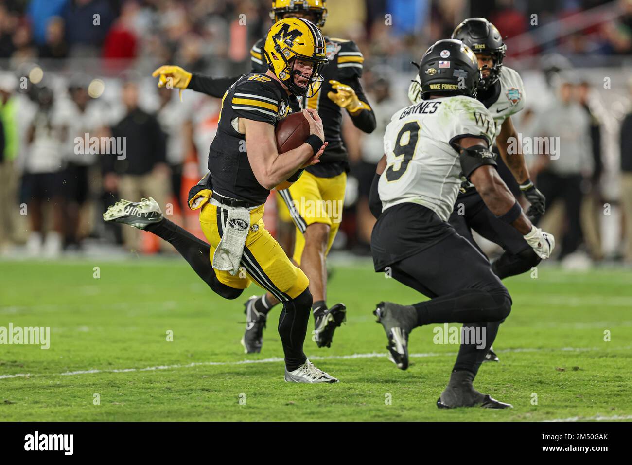 Tampa Bay, FL USA; Missouri Tigers quarterback Brady Cook (12) runs ...