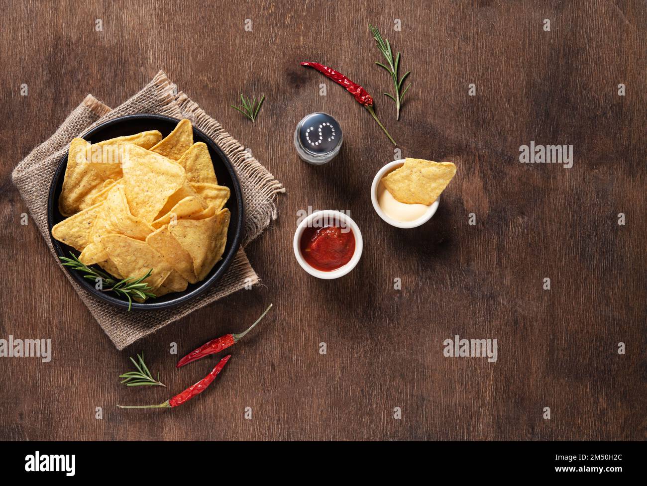 Flat lay with traditional Mexican corn chips nachos with salsa and ...