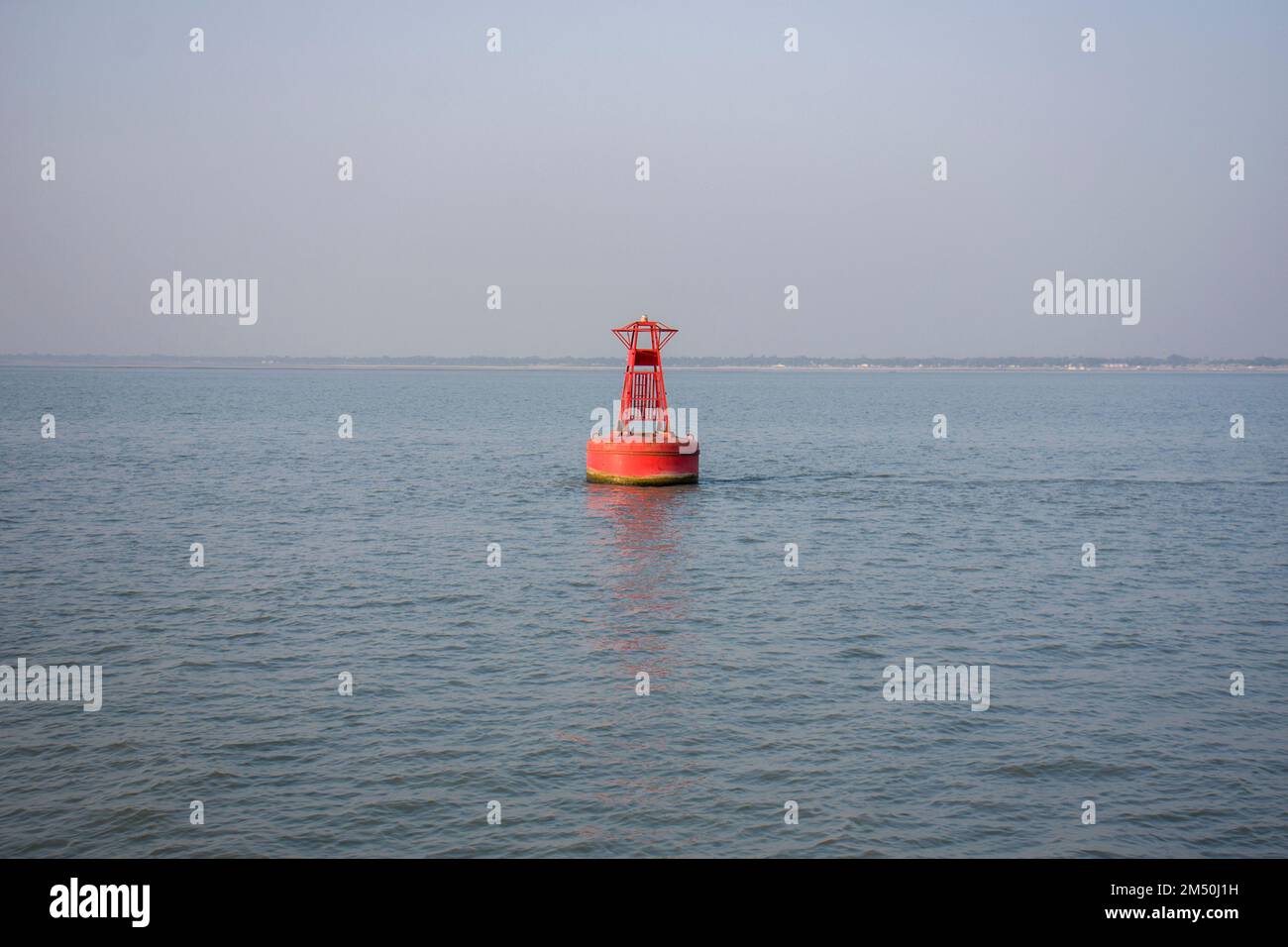 Floating pillars indicating the river course Stock Photo - Alamy