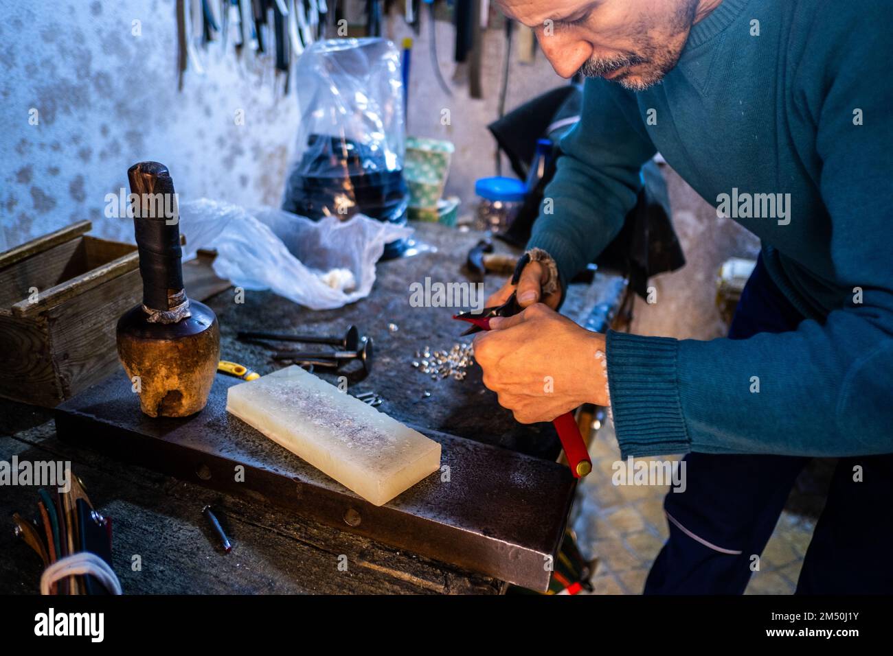 Fes, Morocco; 7th december 2022: A leather craftsman works in his ...