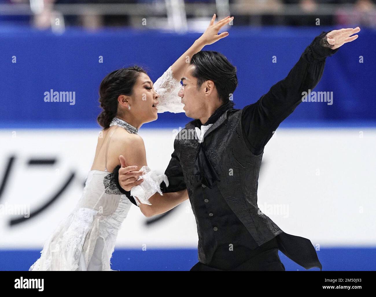 Kana Muramoto (L) and Daisuke Takahashi perform in the ice dance free ...