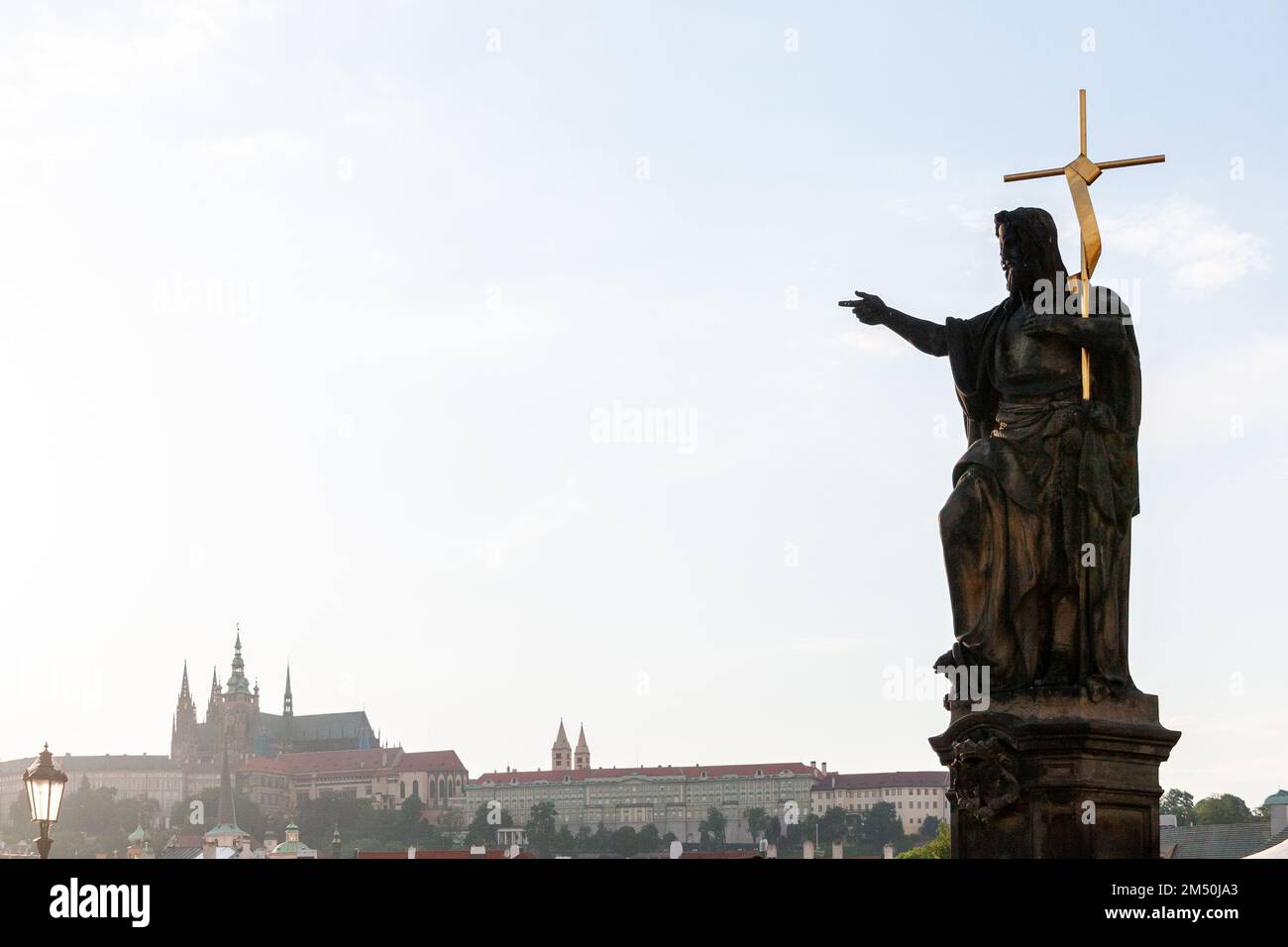 The statue of John the Baptist on Charles Bridge with St. Vitus ...
