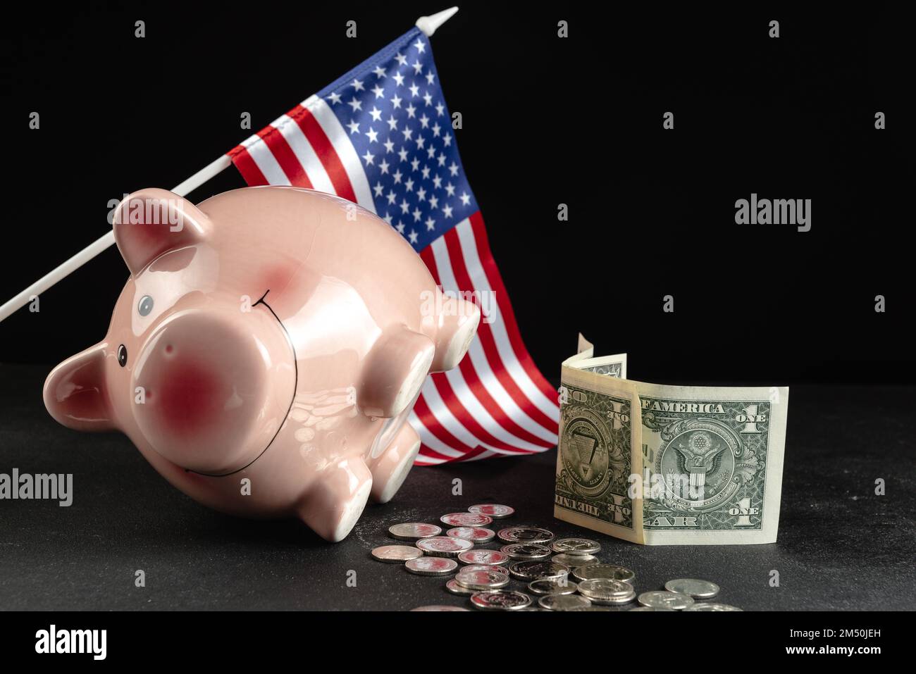 Piggy bank with dollars open on a black background. The global ...