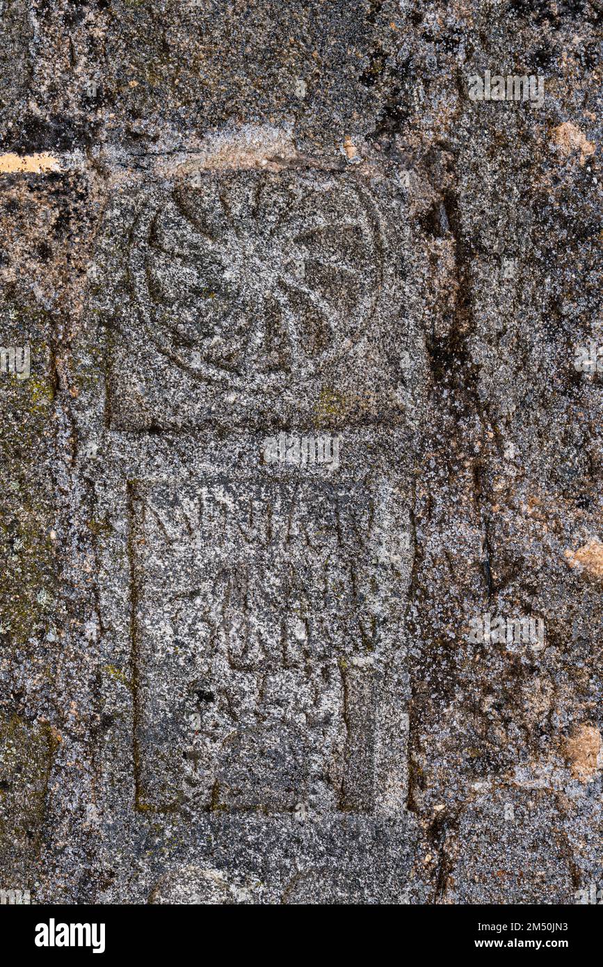 Funerary stele used in ancient stone wall Stock Photo - Alamy
