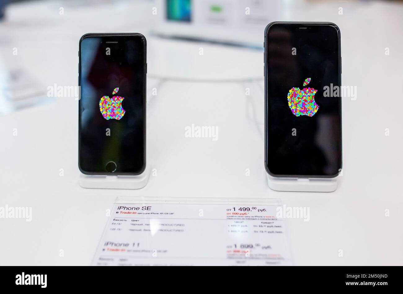 Apple iPhone 12 and Apple iPhone SE with Apple Logo on screen is sold ...