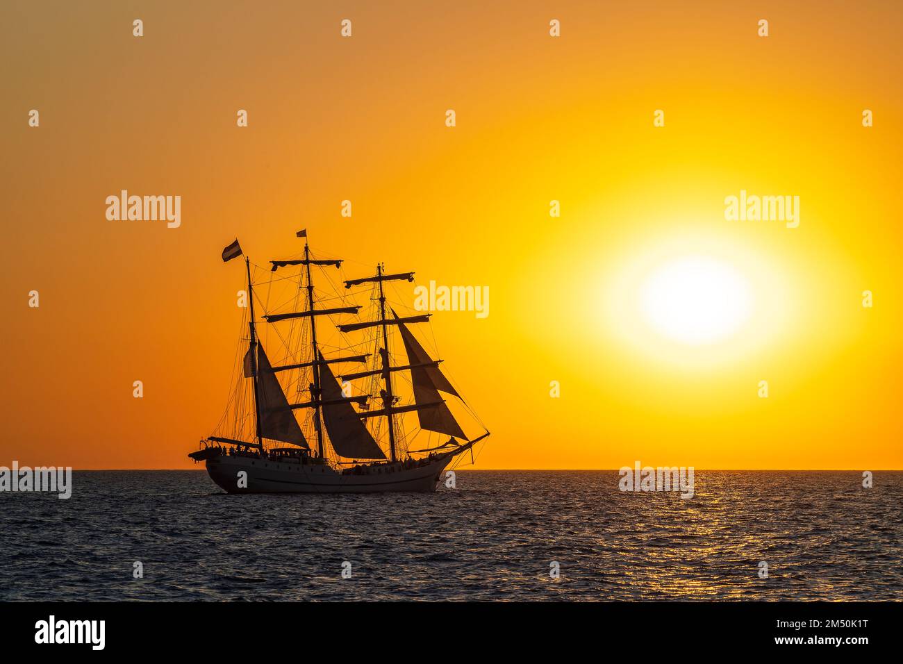 Sailing Ship In The Sunset At The Hanse Sail In Rostock Stock Photo - Alamy