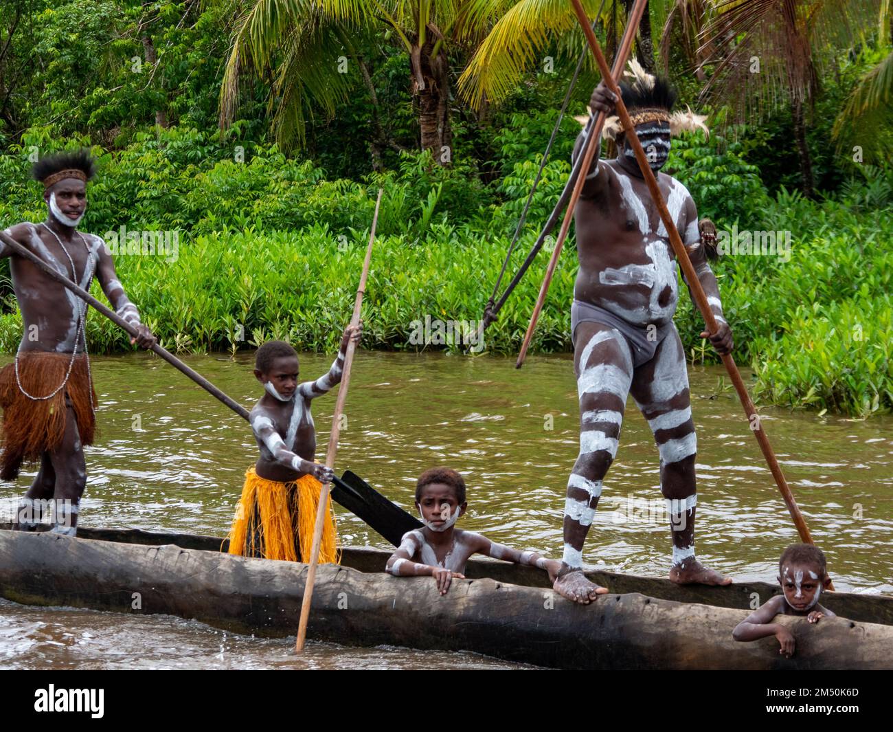 Canoe welcome to the Pem Village in the Asmat region of South Papua ...