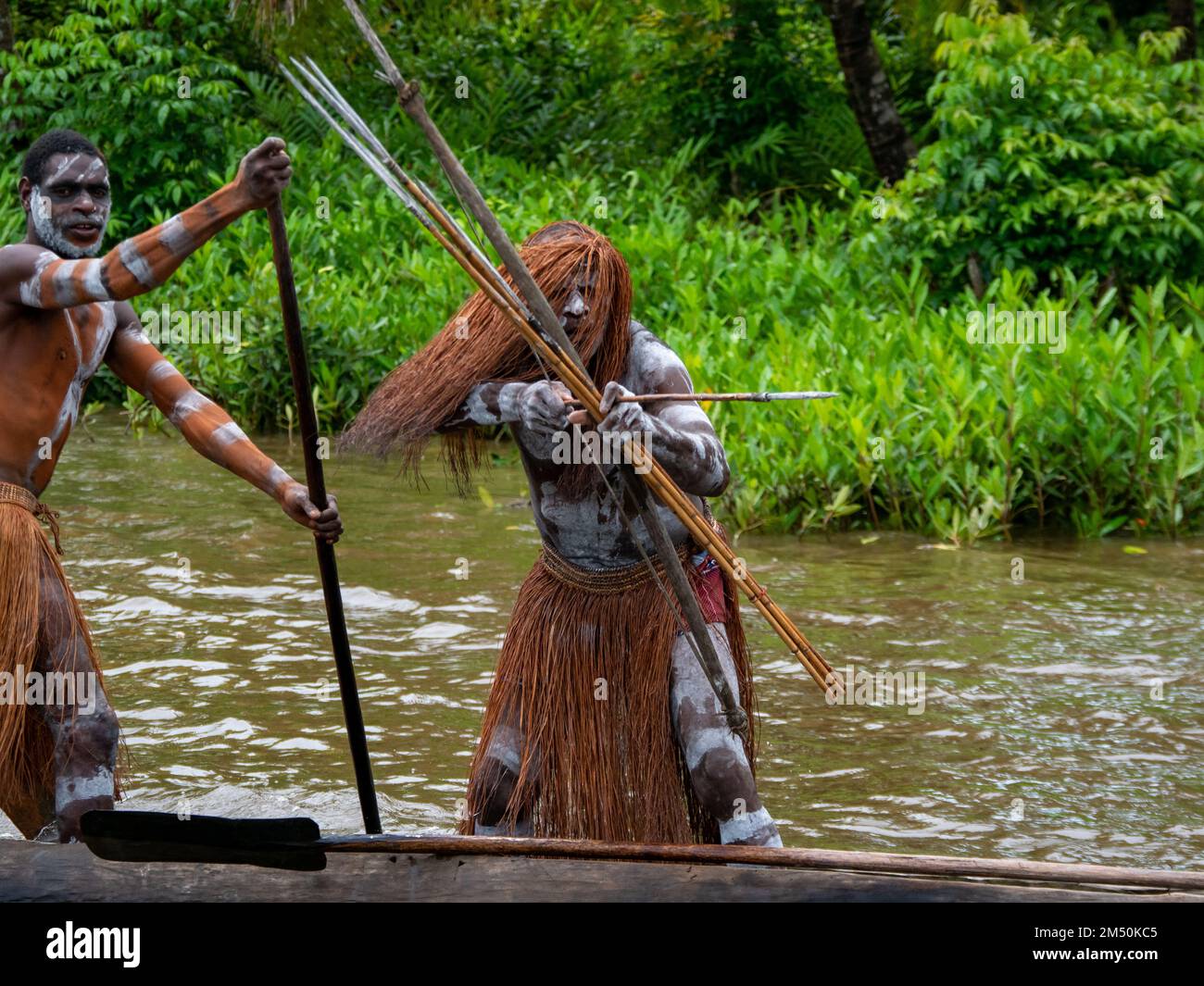 Canoe welcome to the Pem Village in the Asmat region of South Papua ...
