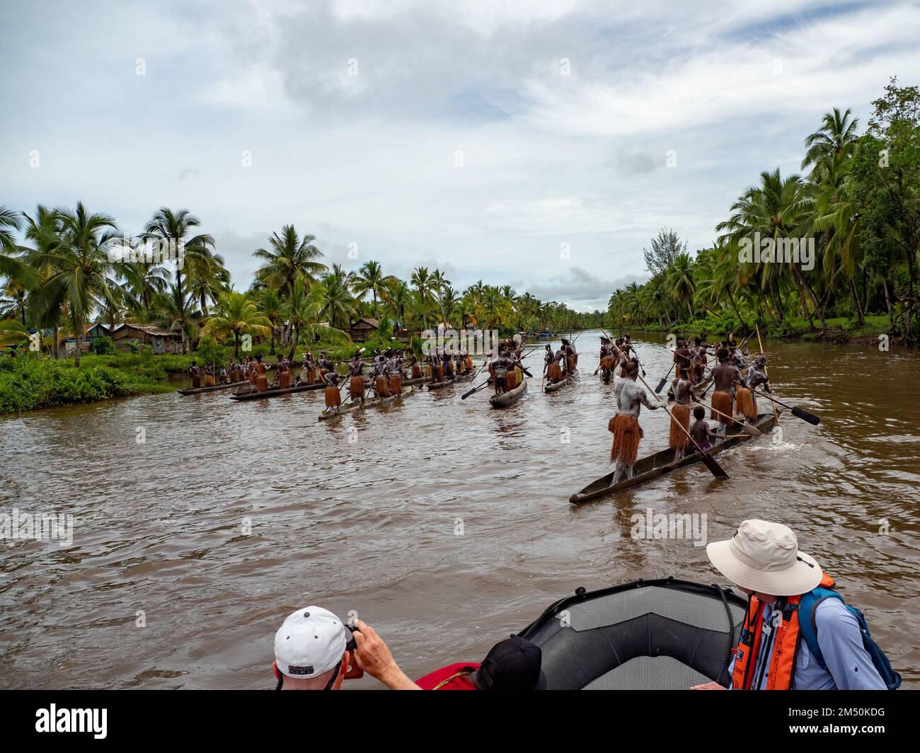 Canoe welcome to the Pem Village in the Asmat region of South Papua ...