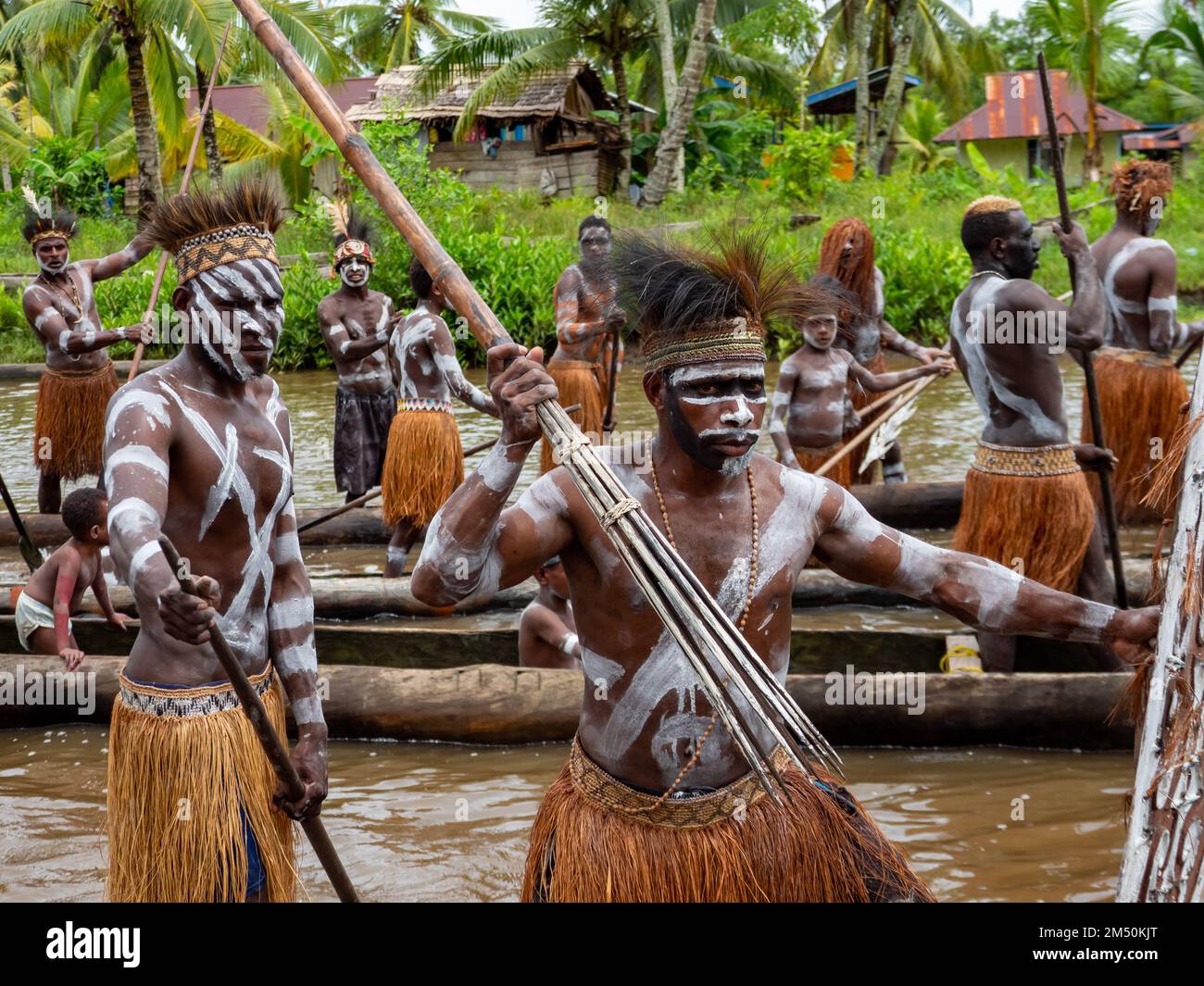Canoe welcome to the Pem Village in the Asmat region of South Papua ...