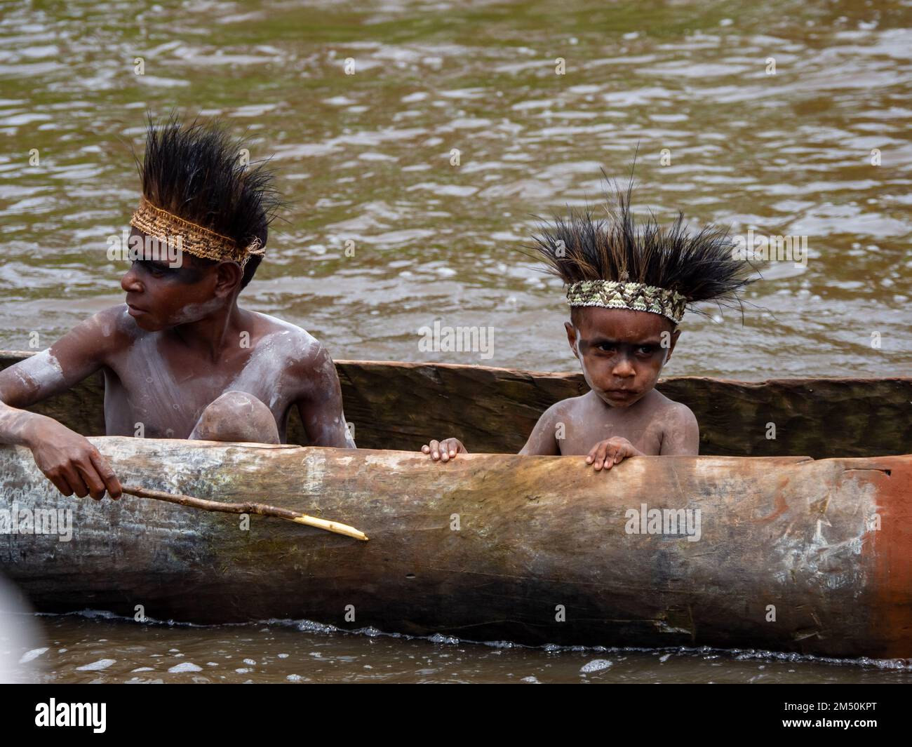 Canoe welcome to the Pem Village in the Asmat region of South Papua ...