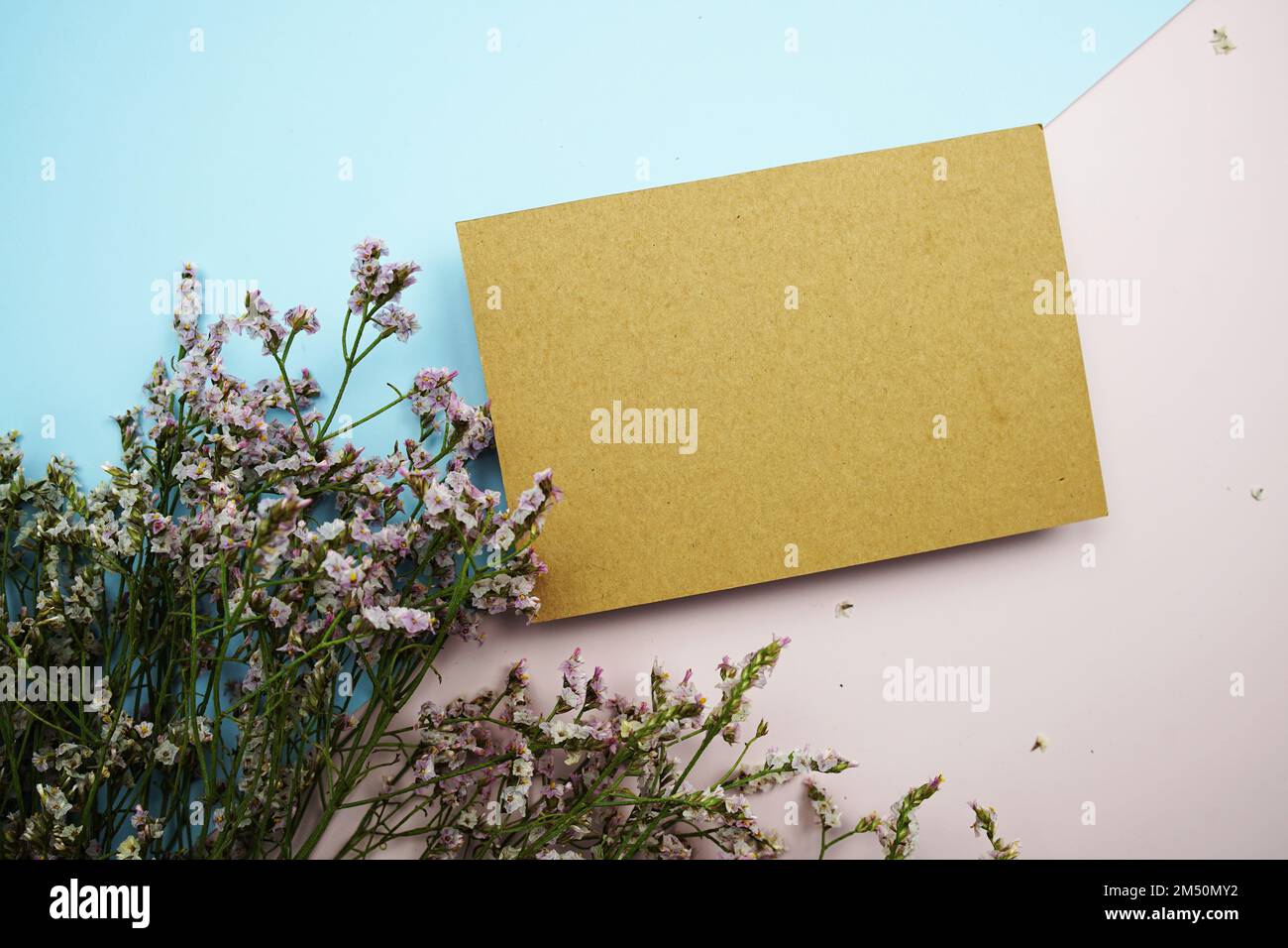 Empty invitation card mockup with flower bouquet on pink and blue ...