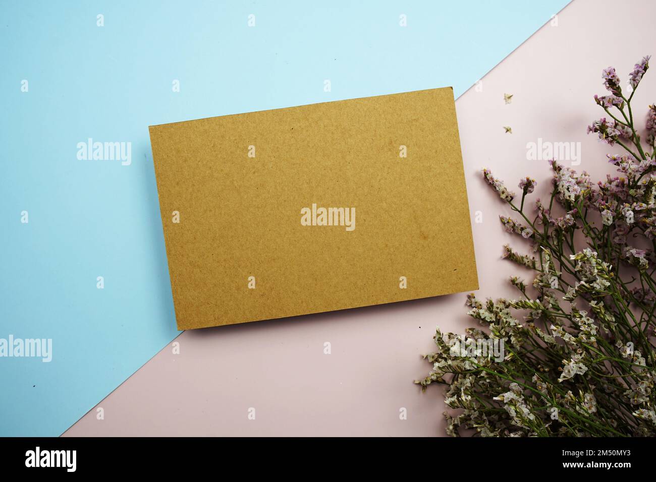 Empty invitation card mockup with flower bouquet on pink and blue ...