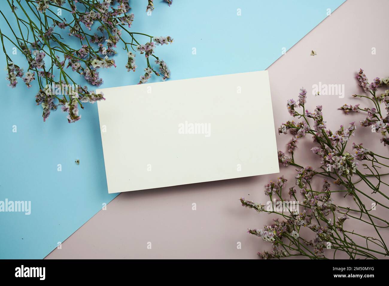 Empty invitation card mockup with flower bouquet on pink and blue ...