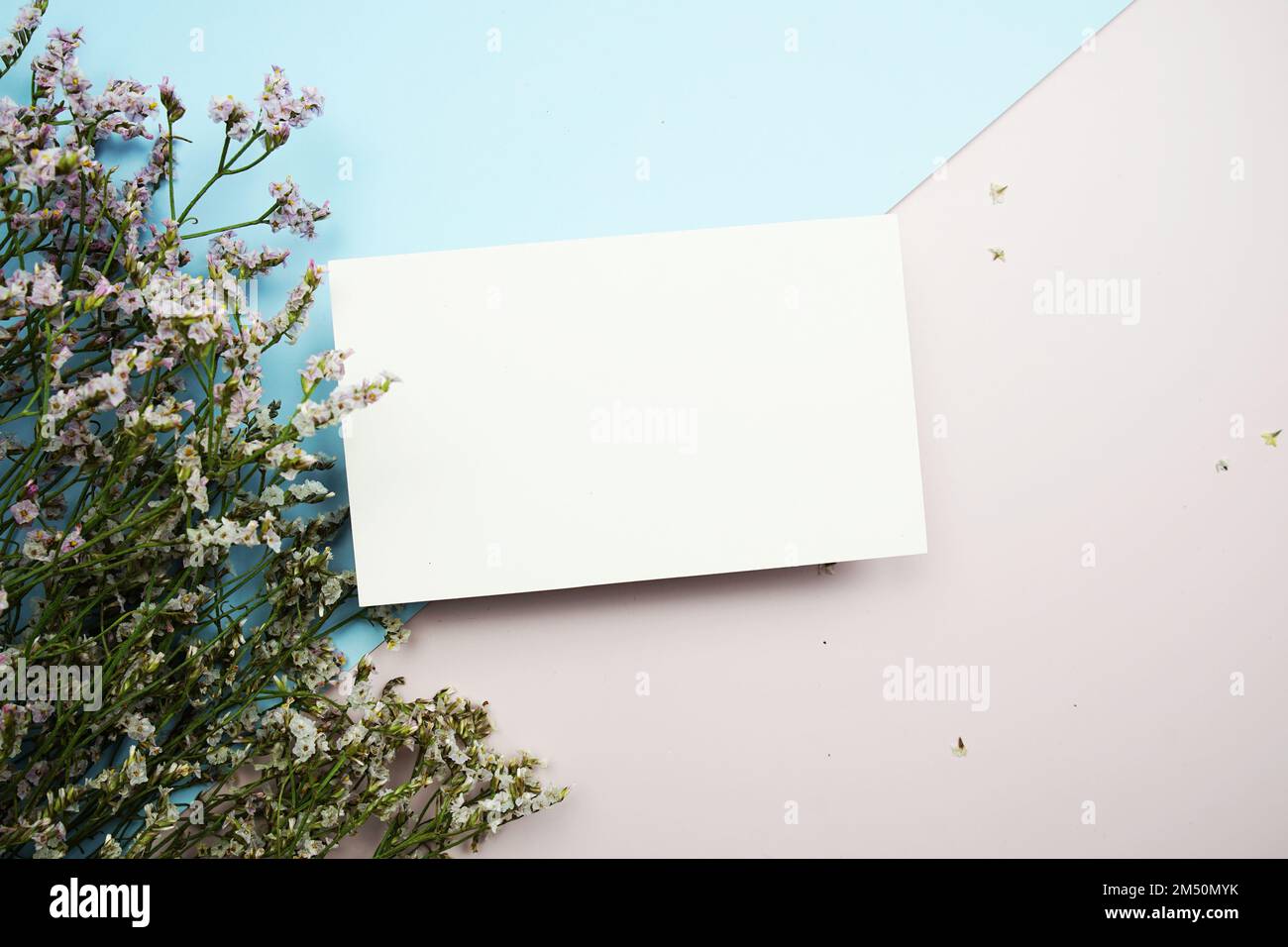 Empty invitation card mockup with flower bouquet on pink and blue ...