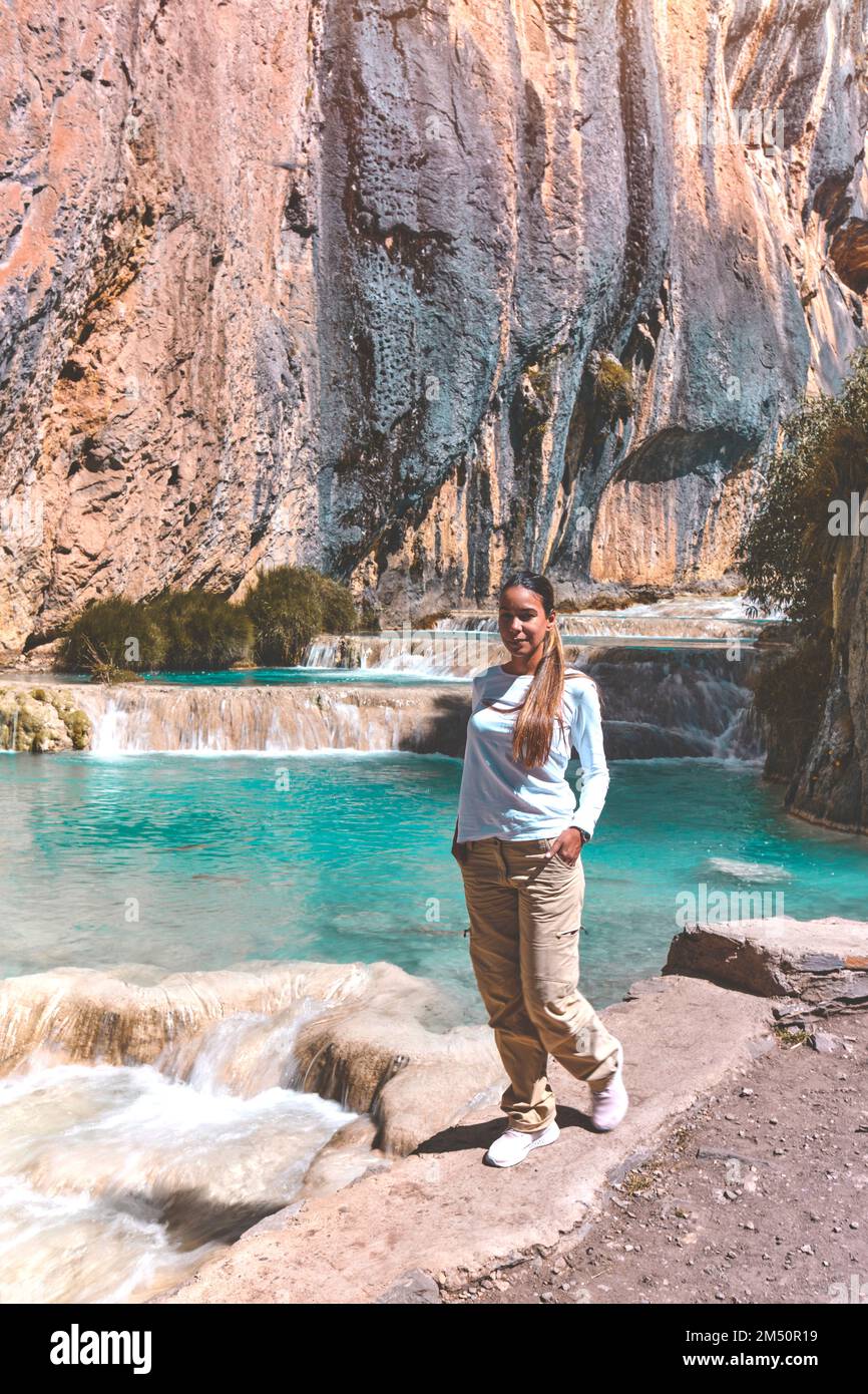 Young woman at viewpoint of the natural pools of Millpu, Ayacucho, Peru ...