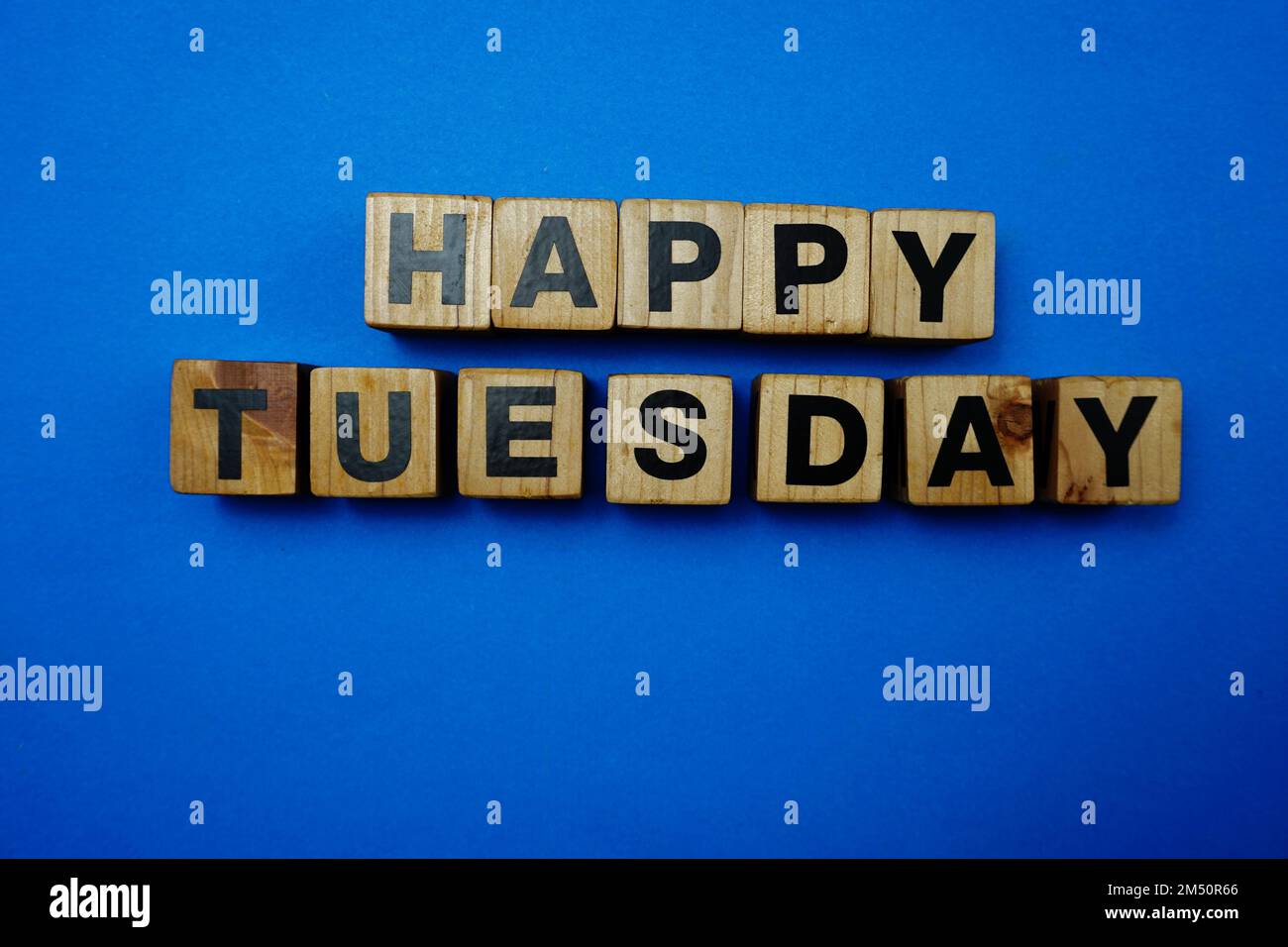 Happy Tuesday text alphabet letter on blue background Stock Photo - Alamy