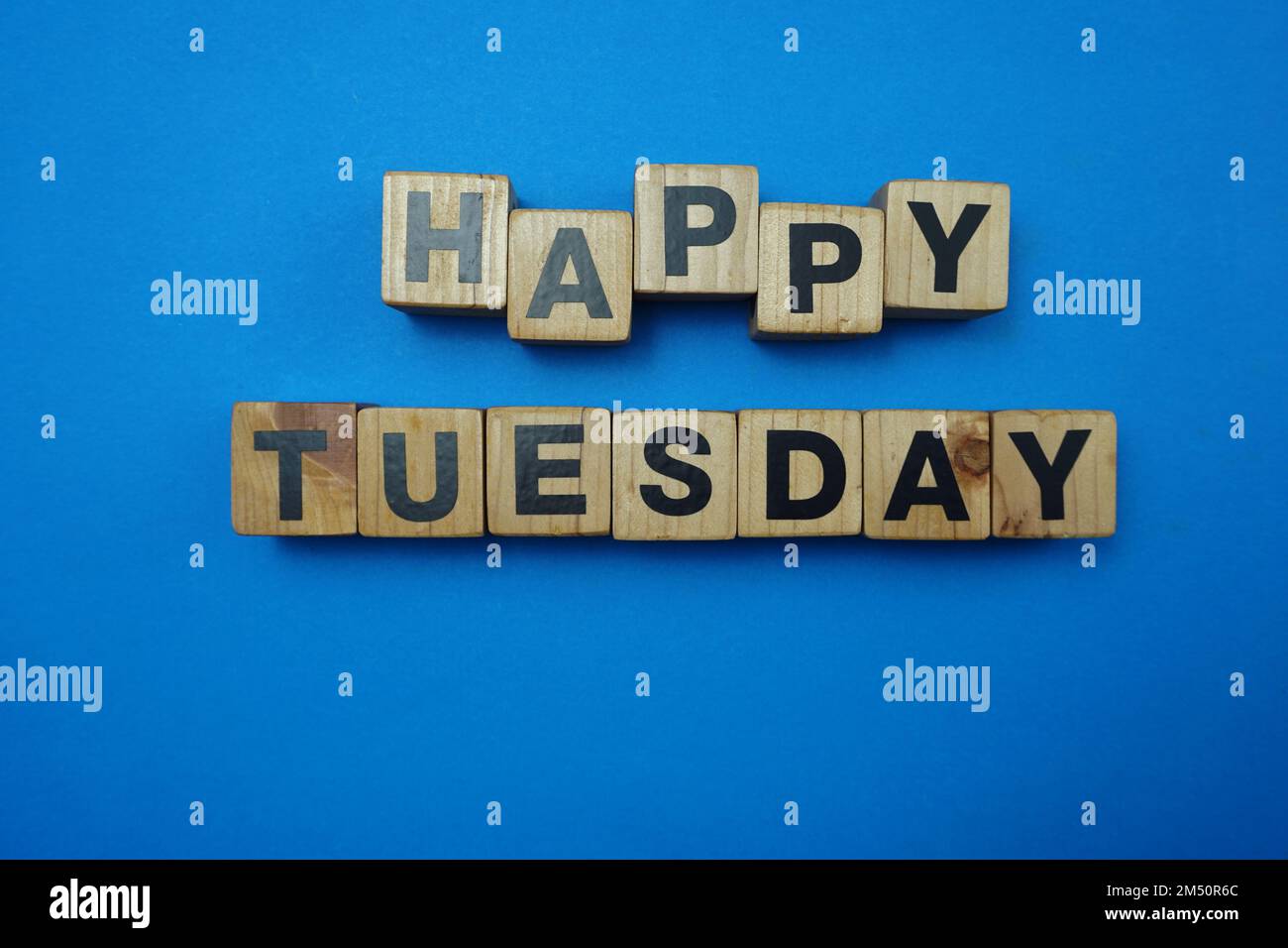 Happy Tuesday text alphabet letter on blue background Stock Photo - Alamy