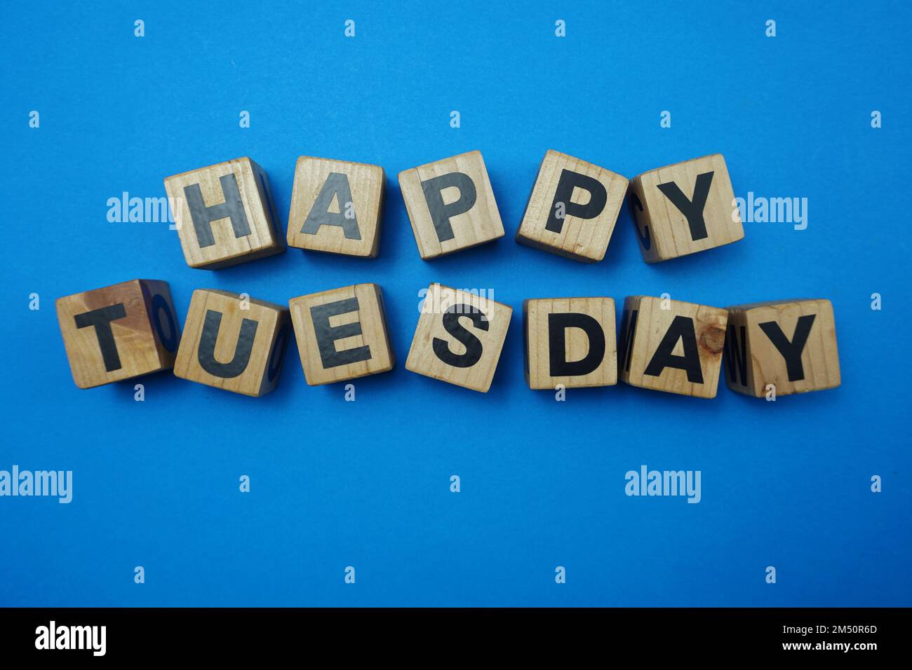 Happy Tuesday text alphabet letter on blue background Stock Photo - Alamy