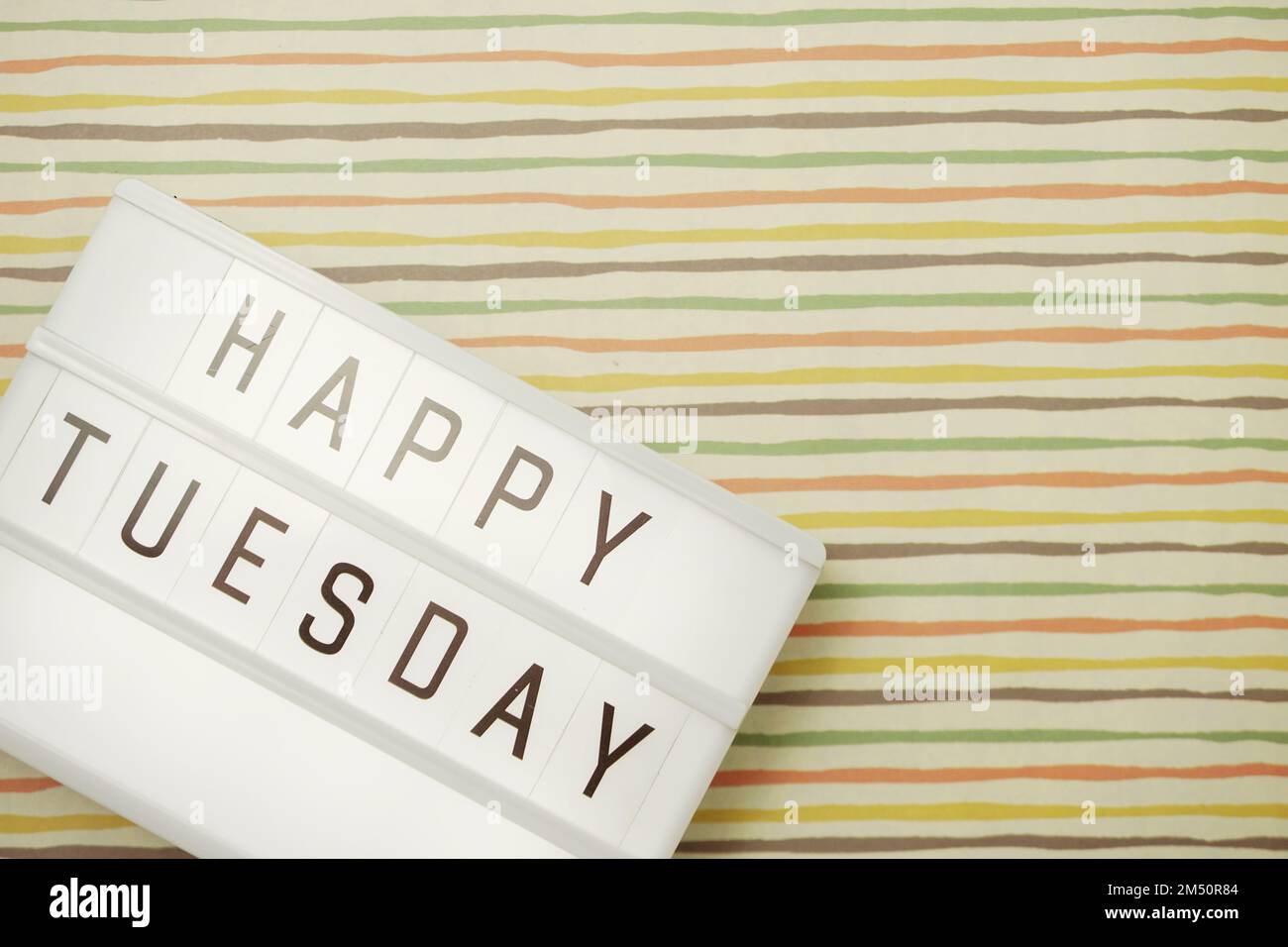 Top view Happy Tuesday Text in Light box flat lay Stock Photo - Alamy