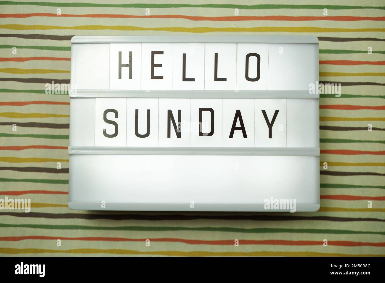 Top view Happy Sunday Text in Light box flat lay Stock Photo - Alamy