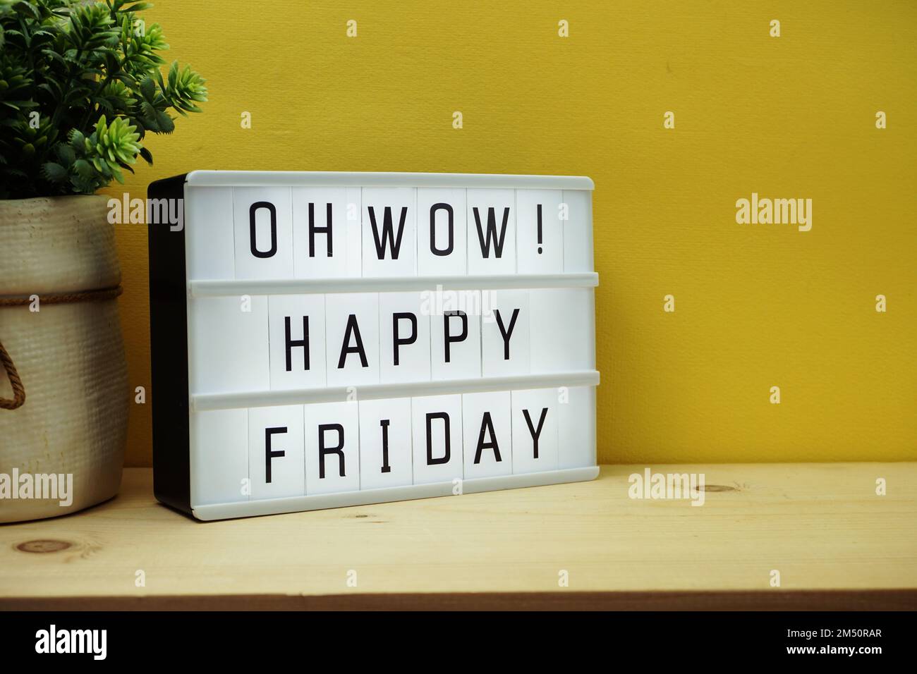 Happy Friday text in lightbox with space copy on yellow background ...