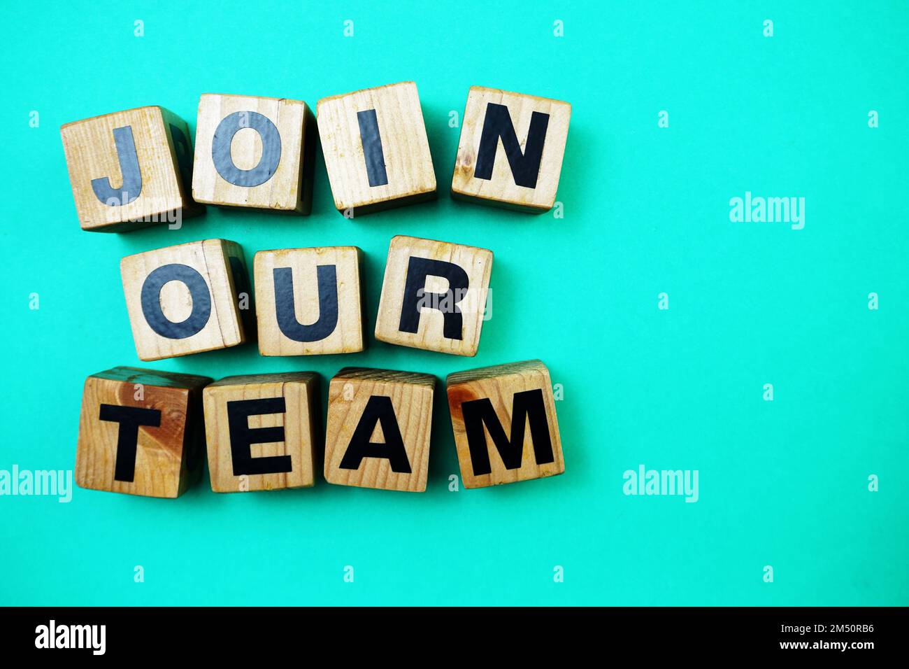 Top view Join our team alphabet letters on green background Stock Photo ...