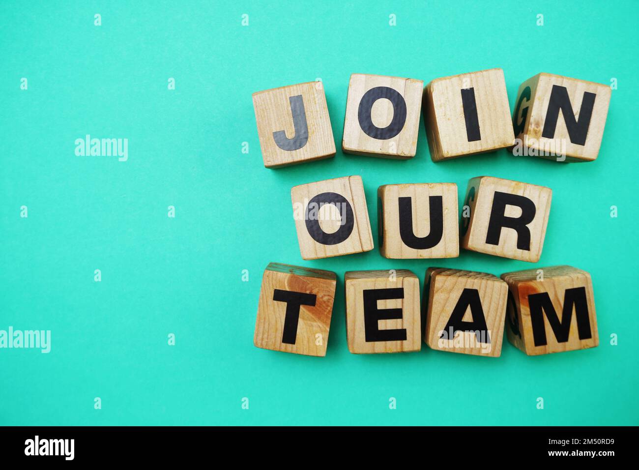 Top view Join our team alphabet letters on green background Stock Photo ...