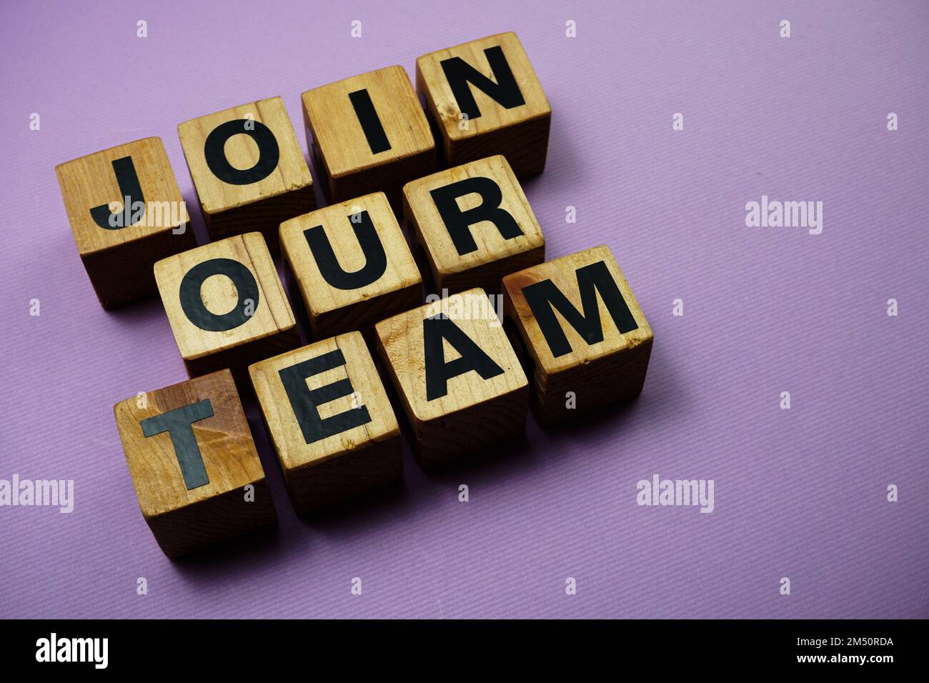 Top view Join our team alphabet letters on purple background Stock ...