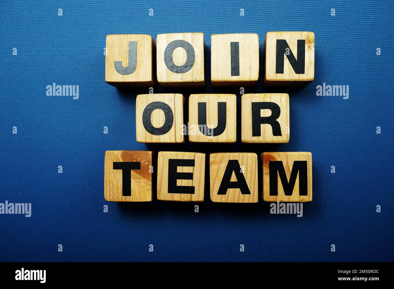 Top view Join our team alphabet letters on blue background Stock Photo ...
