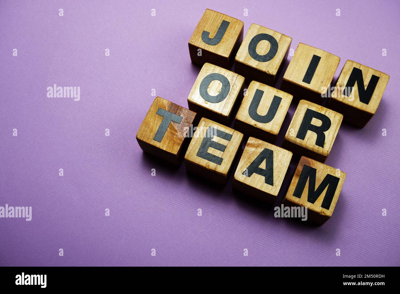 Top view Join our team alphabet letters on pur[e background Stock Photo ...