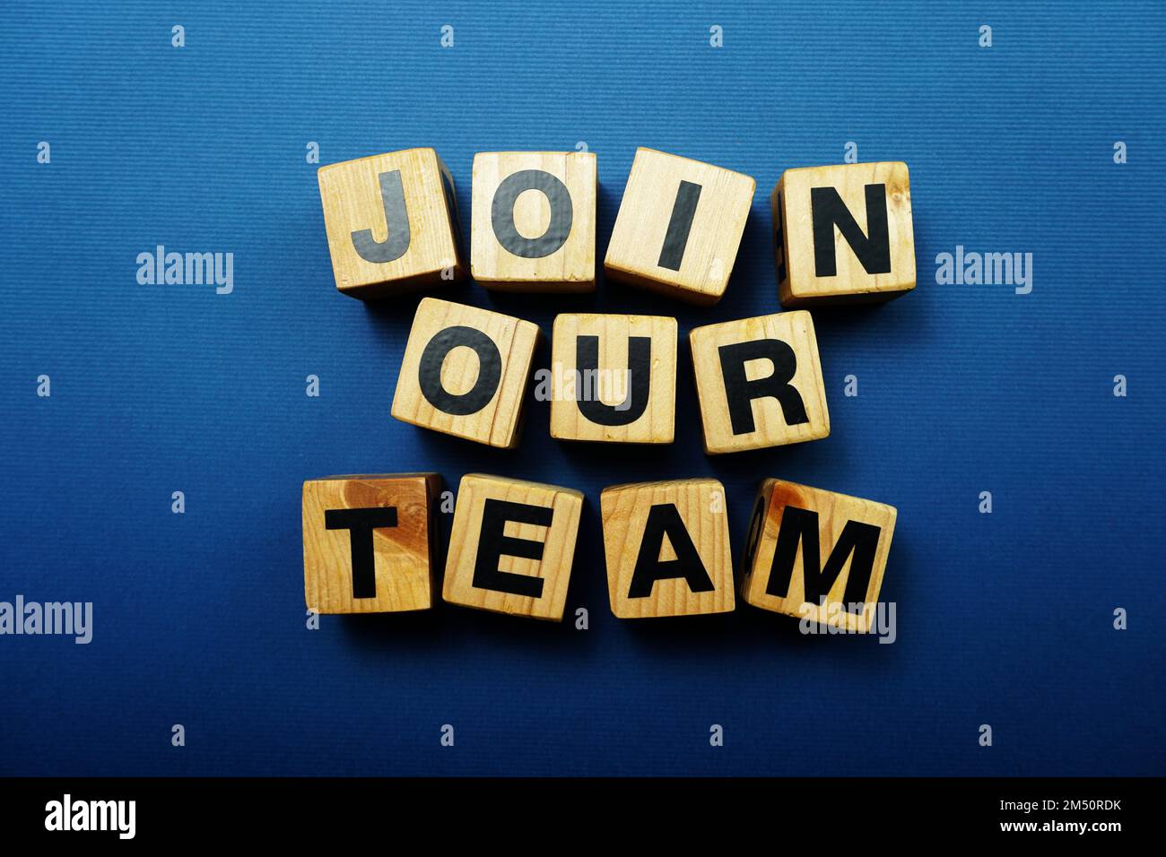 Top view Join our team alphabet letters on blue background Stock Photo ...