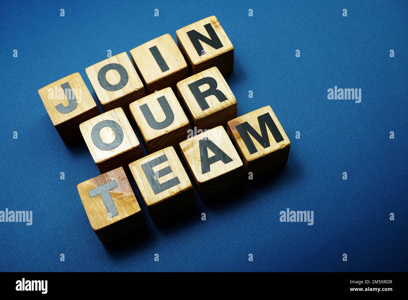 Top view Join our team alphabet letters on blue background Stock Photo ...