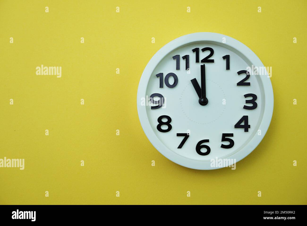 Wall clock showing time eleven hi-res stock photography and images - Alamy