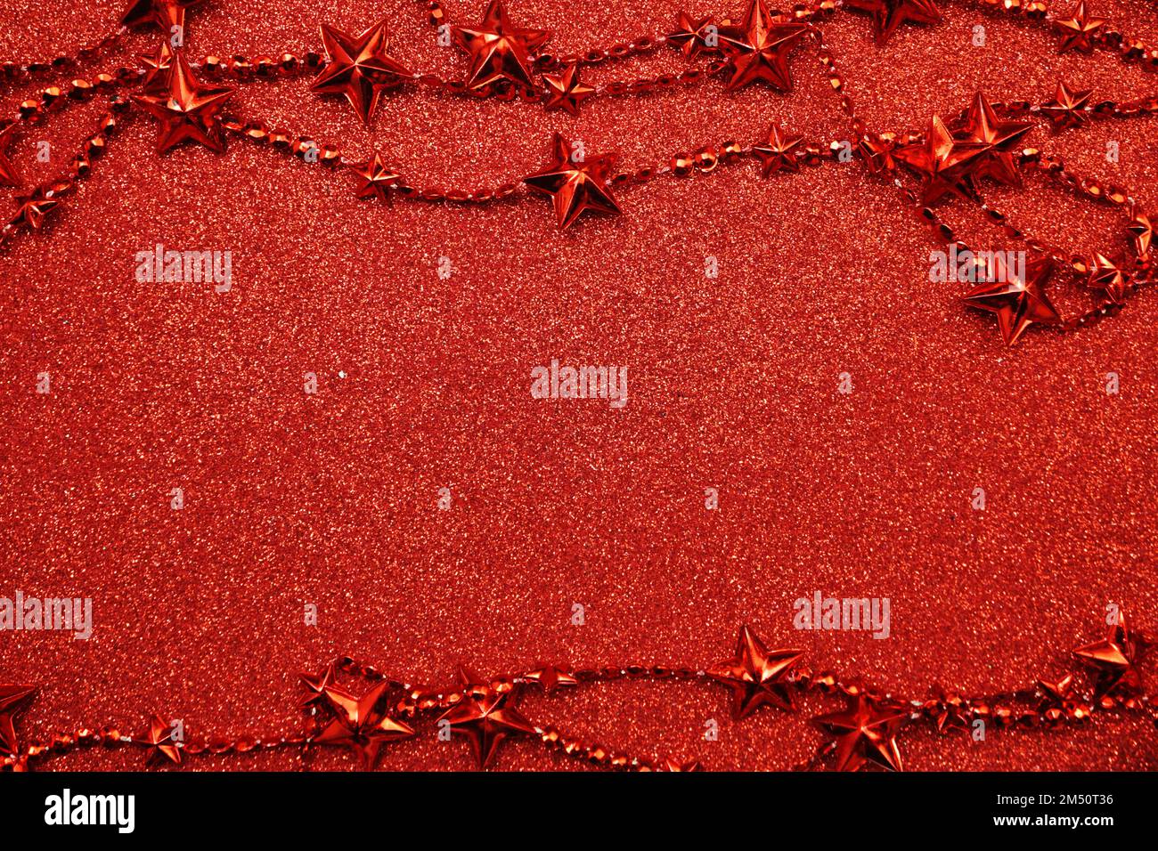 Christmas garlands with red stars decorations with space copy on red ...