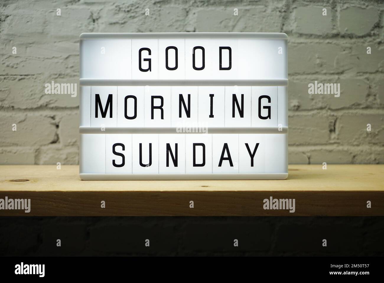 Good Morning Sunday word in light box on wooden shelves Stock Photo - Alamy