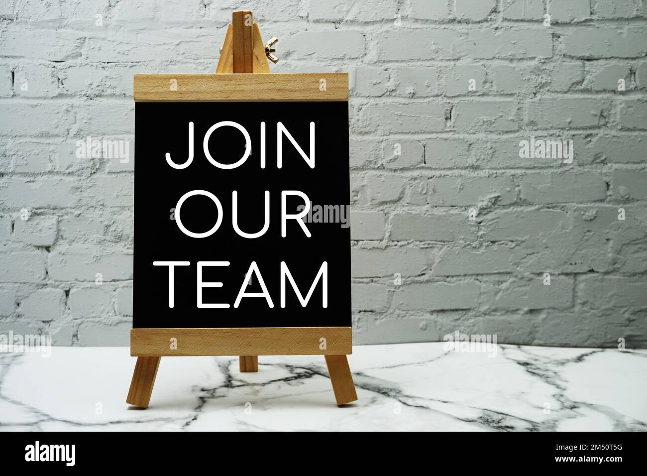 Join Our Team typography text on Easel wooden Stock Photo - Alamy