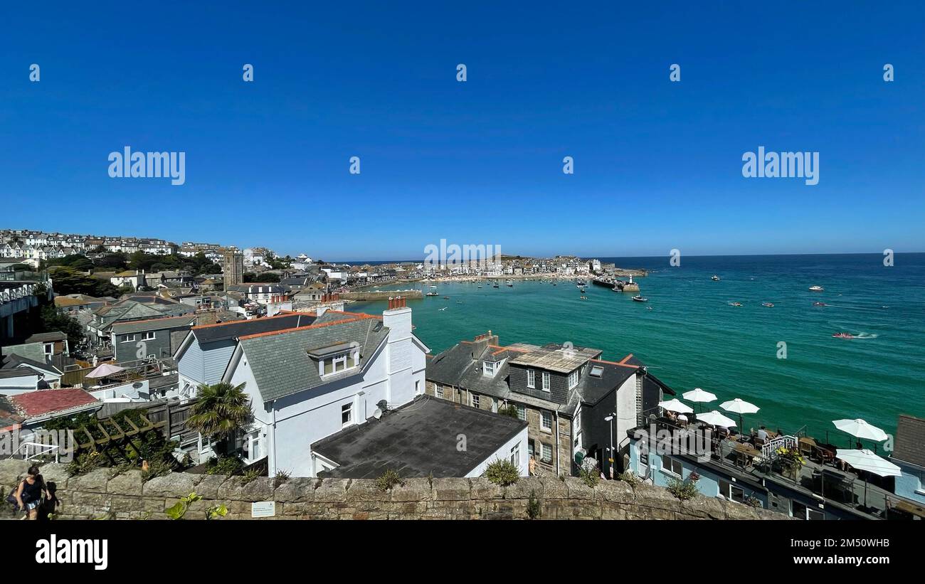 An aerial view of St Ives city coast with houses and blue sky on the ...