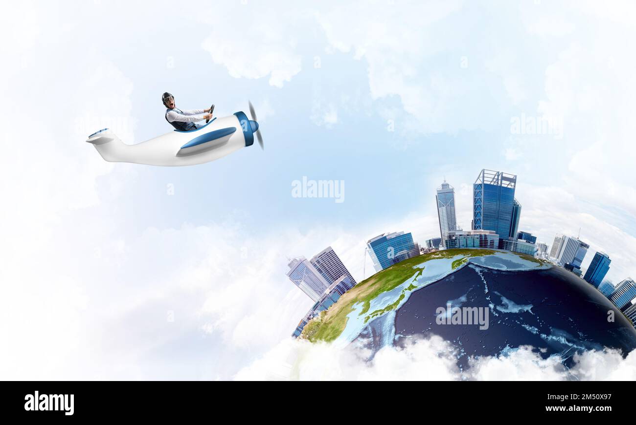 Businessman in aviator leather hat driving plane Stock Photo - Alamy