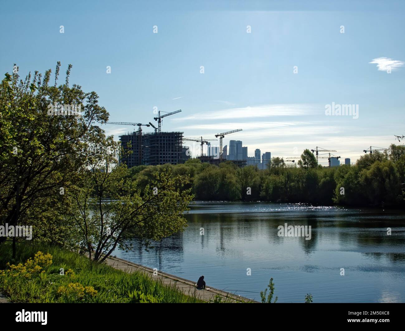 river embankment made of concrete slabs on a clear day, in summer Stock ...